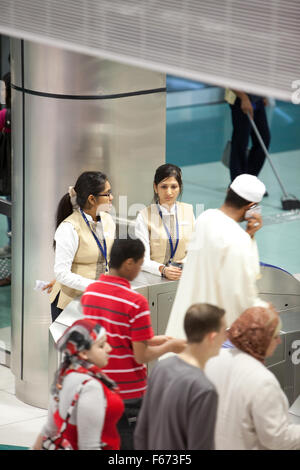 Dubai Metro station staff attending to the public Stock Photo - Alamy