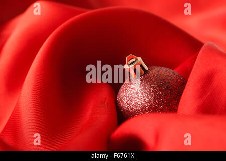 red Christmas balls, wrapped in cloth Stock Photo - Alamy