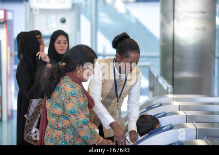 Staff of the Dubai Metro assisting the public Stock Photo - Alamy