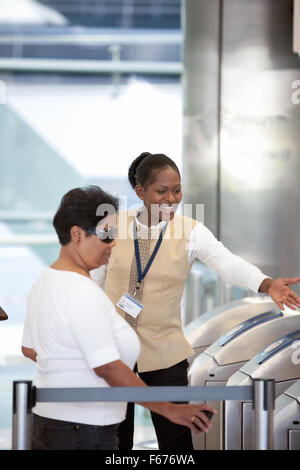 Staff of the Dubai Metro assisting the public Stock Photo - Alamy