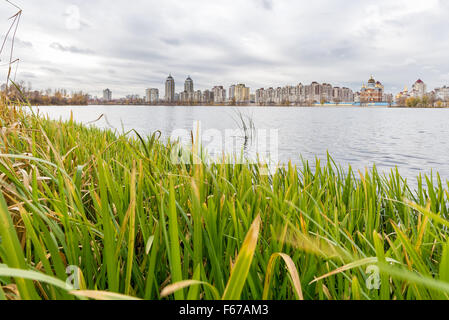 Obolon Skyline close to the Dnieper river in Kiev, Ukraine. Quiet water ...