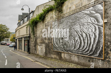 Street art on Walcot Street, Bath,Somerset, UK. People walk past the ...