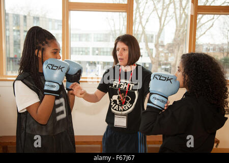Female teenager students being coached in boxing Stock Photo - Alamy