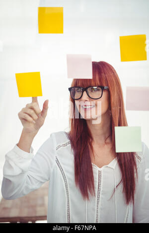 Attractive hipster woman pointing sticky notes Stock Photo - Alamy