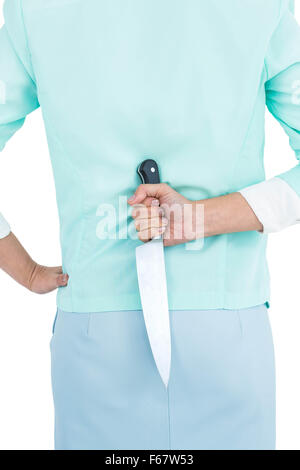 rear view of woman with knife behind her back Stock Photo - Alamy