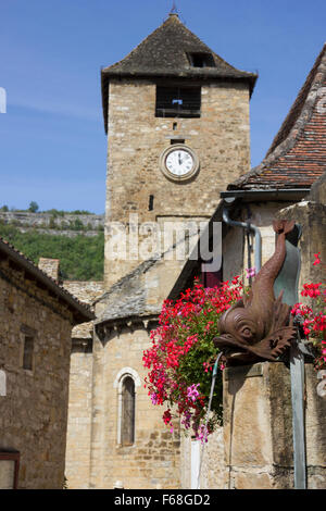 The church tower of the medieval village of Autoire on a frosty winters ...