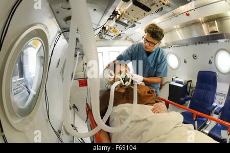 Compression chamber operator and hospital aide Rene Kriesel constantly ...