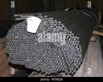 steel rods in factory warehouse Stock Photo - Alamy