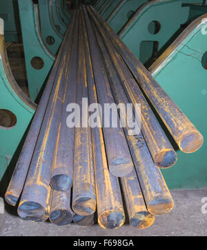 Steel round bar storage Stock Photo - Alamy