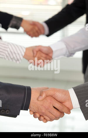 Chinese businesspeople shaking hands Stock Photo - Alamy