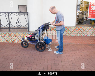 Western girl texting on her smartphone in a bar in la Havana, Cuba ...