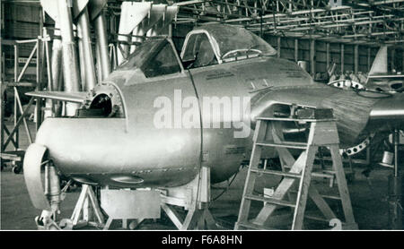 This image shows a de Havilland Vampire jet aircraft severely damaged ...