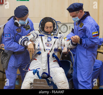 Elena Serova, Russian cosmonaut, completes a pressure check of her ...