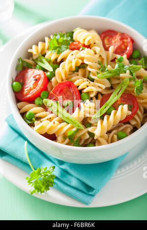 vegetarian pasta fusilli with tomato peas herbs Stock Photo - Alamy