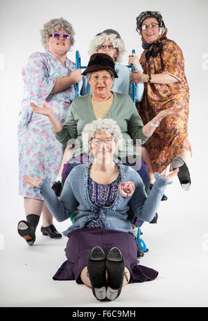 Group shot of ladies dressed as OAP in front of a white background. (No ...