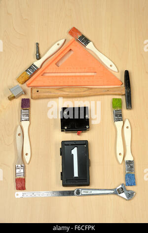 House made out of tools over wooden surface Stock Photo - Alamy