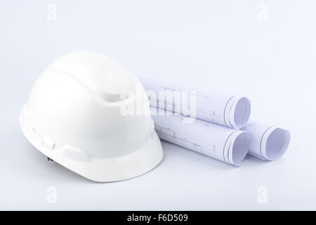 White safety helmet and Scrolls of engineering drawings Stock Photo - Alamy