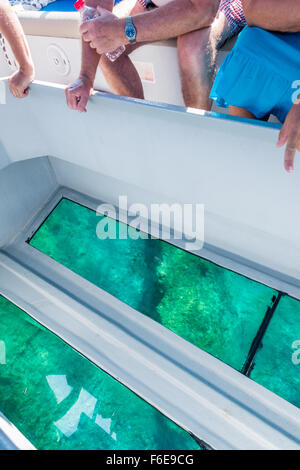 Underwater view of bottom of boat looking up through Snell's window ...