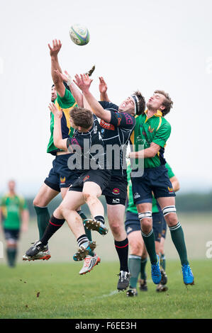 Rugby player reaching to catch ball Stock Photo - Alamy