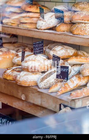Bread display in a bakery window Stock Photo - Alamy