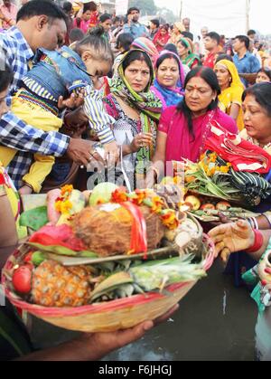 Hindu devotees perform rituals at sunset in the River Sabarmati during ...