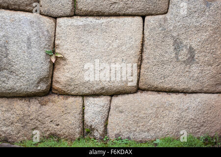 Wall made of stone blocks demonstrates ancient Incan precision building ...