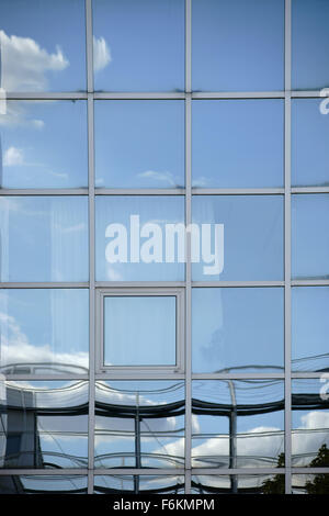 Reflection of the sky and clouds in the glazing of modern high-rise ...