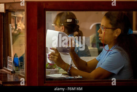 Postal worker at a post office in Boise Idaho USA Stock Photo - Alamy