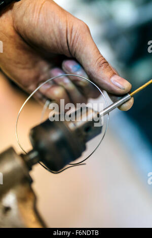 Hand of man holding drill wrapped in black tape. Hardware worker tool ...