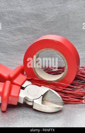 A set of red and grey hardware tools on wooden background Stock Photo ...