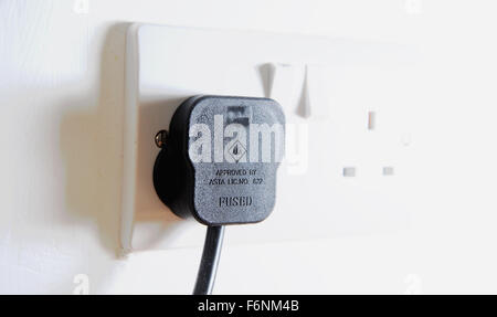 Standard black British household power plug with 13 A fuse with cable ...
