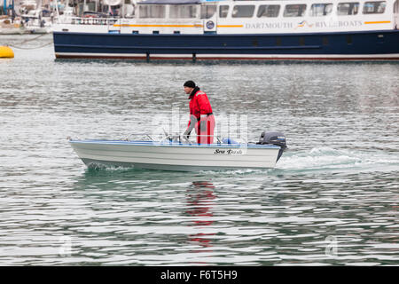 A man in an outboard powered dinghy at Lake Rotoiti Nelson Lakes ...