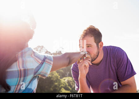 Guy kissing hand of his girlfriend Stock Photo - Alamy