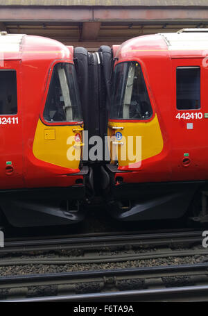 connection between passenger cars train on railway, close up. Buffer ...