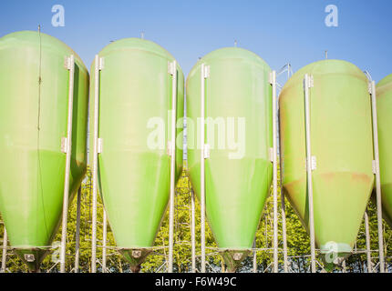 Agricultural green silos. Silos for animal food Stock Photo - Alamy