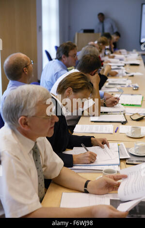 Group of employees at an NHS teamwork meeting Stock Photo - Alamy
