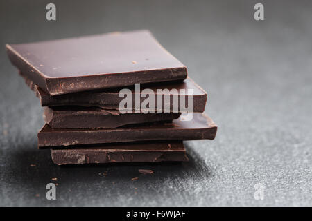 thin chocolate bars on slate background Stock Photo - Alamy