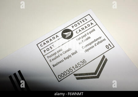 A Canada Post postage paid stamp on a letter photographed against a ...