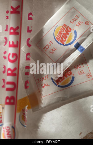 Burger King fries with salt sachets and straw Stock Photo - Alamy