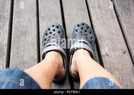 Pair of shoes standing from an aerial view on wooden background Stock ...