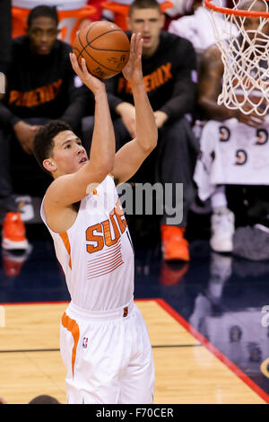 Phoenix Suns' Devin Booker (1) drives past Brooklyn Nets' Keon Johnson ...