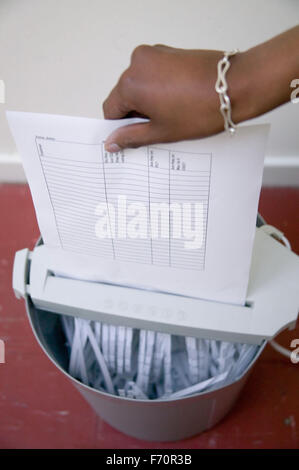 woman shredding documents Stock Photo - Alamy