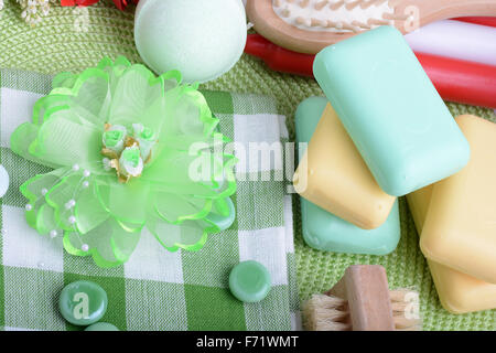 Hair brush, sea salt and cosmetics on color background Stock Photo - Alamy