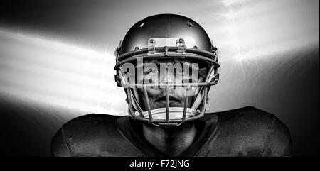 Composite image of portrait of determined american football player in ...