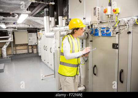 Engineer checking the temperature pipes Stock Photo - Alamy