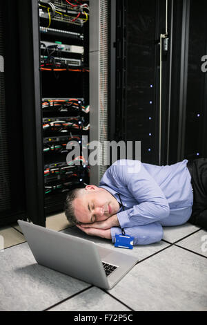 Man sleeping in data center Stock Photo - Alamy