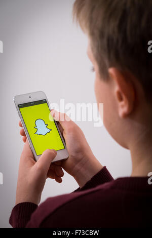 A boy using the app Snapchat Stock Photo - Alamy