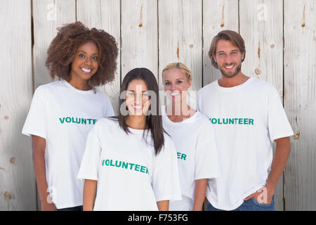 Composite image of happy group of volunteers giving thumbs up Stock ...