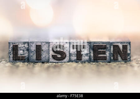 The word "LISTEN" written in vintage, dirty, ink stained letterpress ...