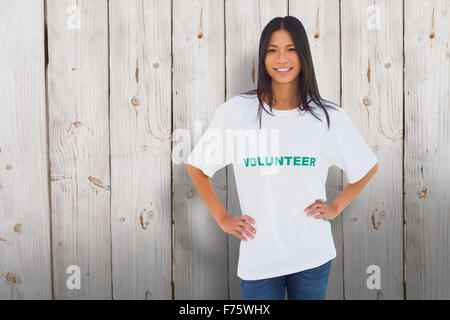 Asian young woman wearing volunteer t shirt at donations stand crazy ...